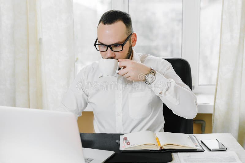 Businessman Drinking Coffee in the Workplace Stock Photo - Image of ...