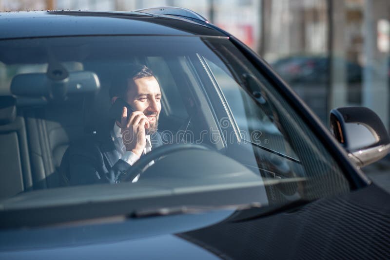 Businessman driving a car stock photo. Image of driving - 132090820
