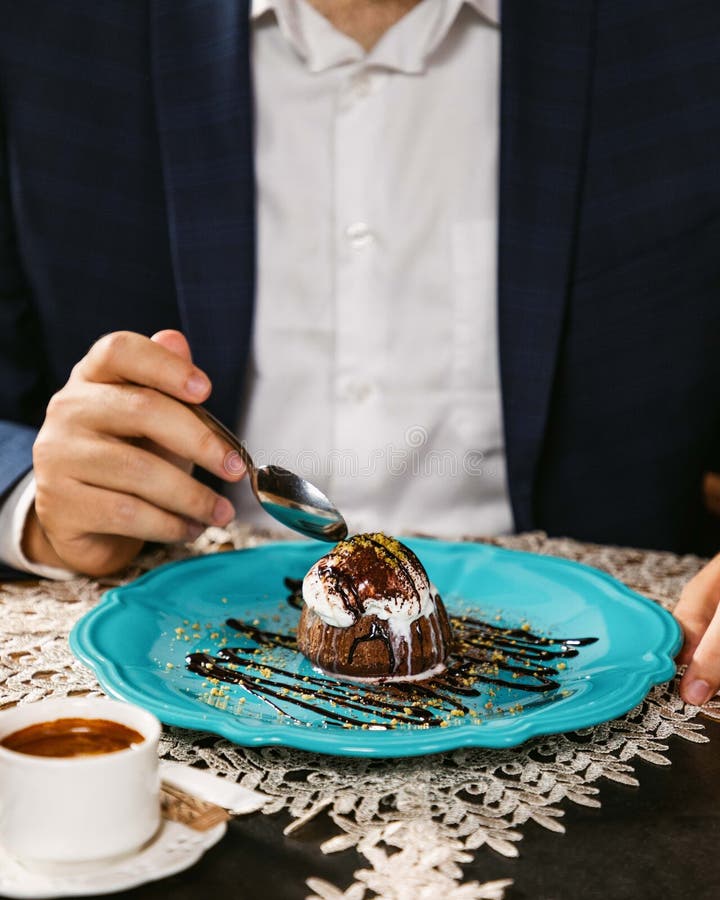 Man Eating Chocolate Dessert at the Restaurant Stock Photo - Image of ...
