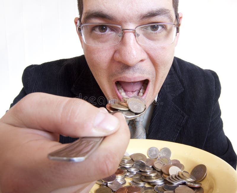 Businessman eating money stock photo. Image of angle - 24031284