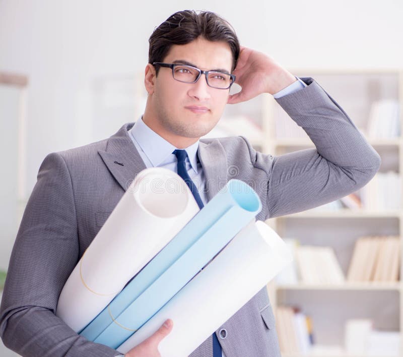 The Businessman Engineer Draftsman with Blueprints Drawings Stock Photo ...