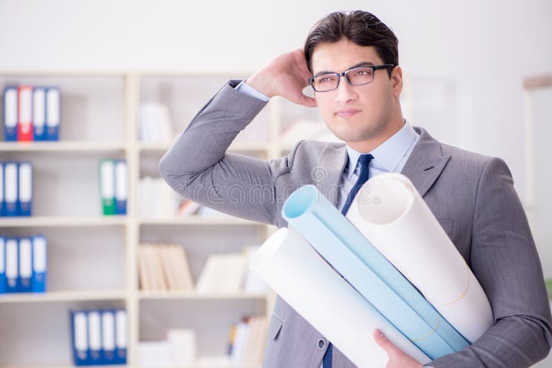 The Businessman Engineer Draftsman with Blueprints Drawings Stock Photo ...