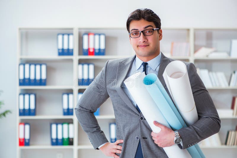 The Businessman Engineer Draftsman with Blueprints Drawings Stock Image ...