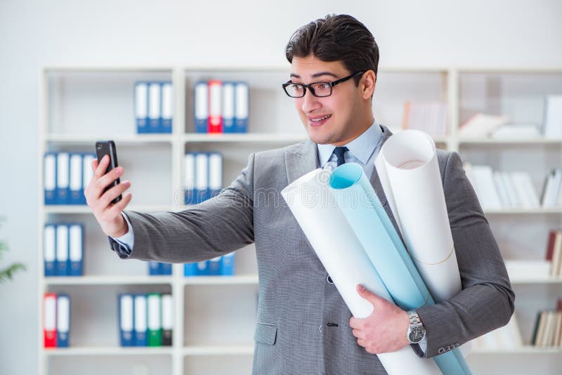 The Businessman Engineer Draftsman with Blueprints Drawings Stock Image ...