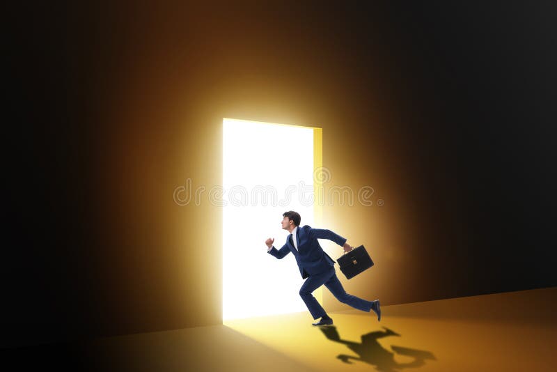 Businessman Entering Backlit Door in Escape Concept Stock Image - Image ...