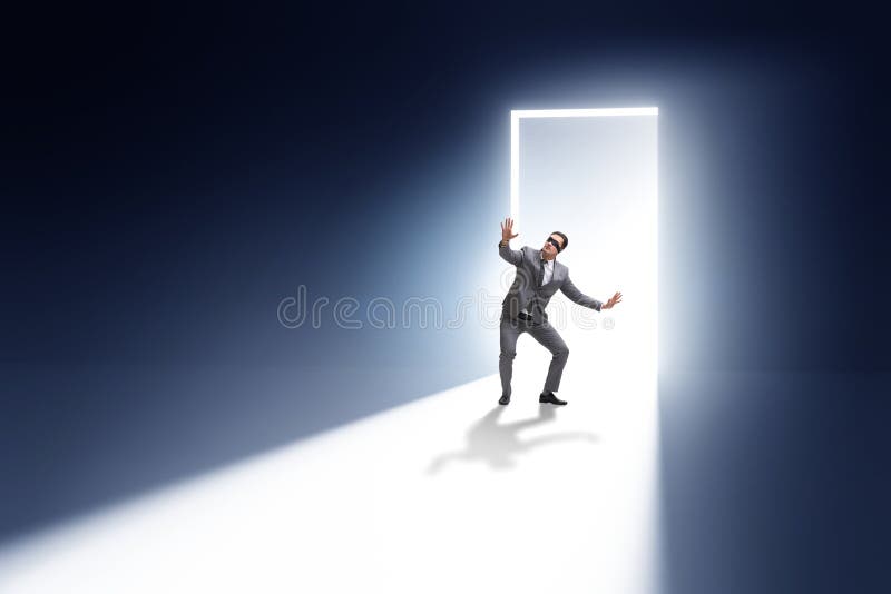 Businessman Entering Backlit Door in Escape Concept Stock Photo - Image ...