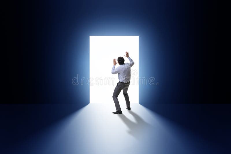 Businessman Entering Backlit Door in Escape Concept Stock Image - Image ...