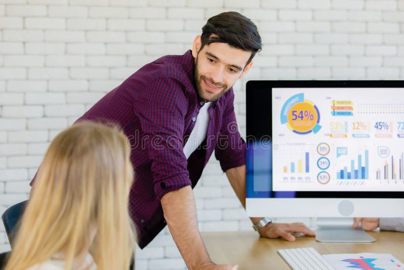 A Businessman Explaining the Information on a Chart for His Colleagues ...