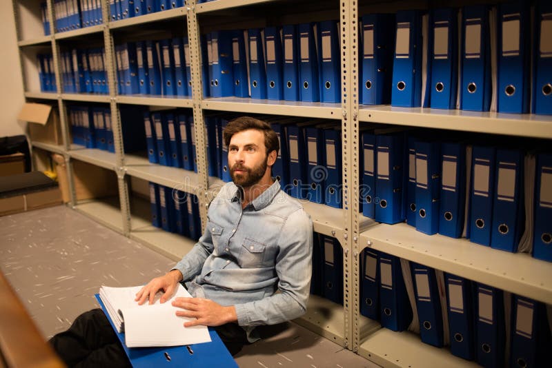 Documents Scattered by Fallen Businessman in File Storage Room Stock ...