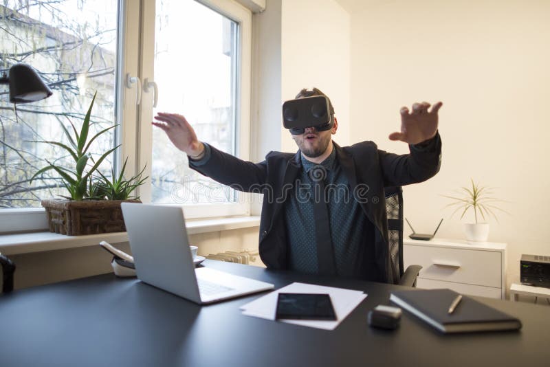 Businessman Finishes His Work and Taking Virtual Reality Goggles on ...