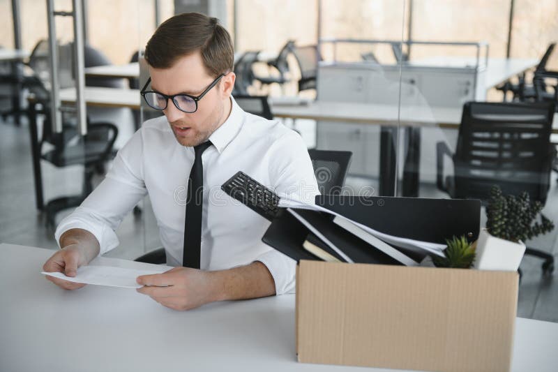 Businessman Fired, Leaving His Office with His Personal Effects Stock ...