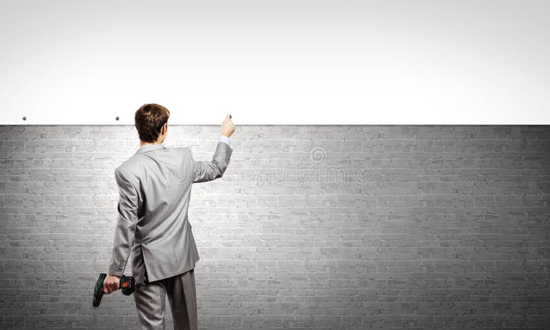 Businessman fixing banner stock image. Image of presentation - 47182083