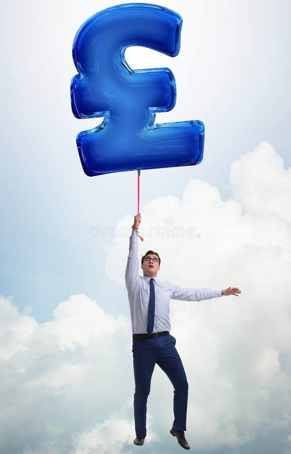 The Businessman Flying on British Pound Sign Inflatable Balloon Stock ...