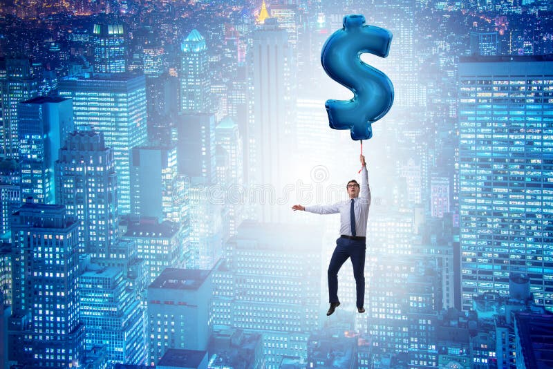 The Businessman Flying on Dollar Sign Inflatable Balloon Stock Photo ...