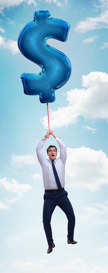 The Businessman Flying on Dollar Sign Inflatable Balloon Stock Photo ...