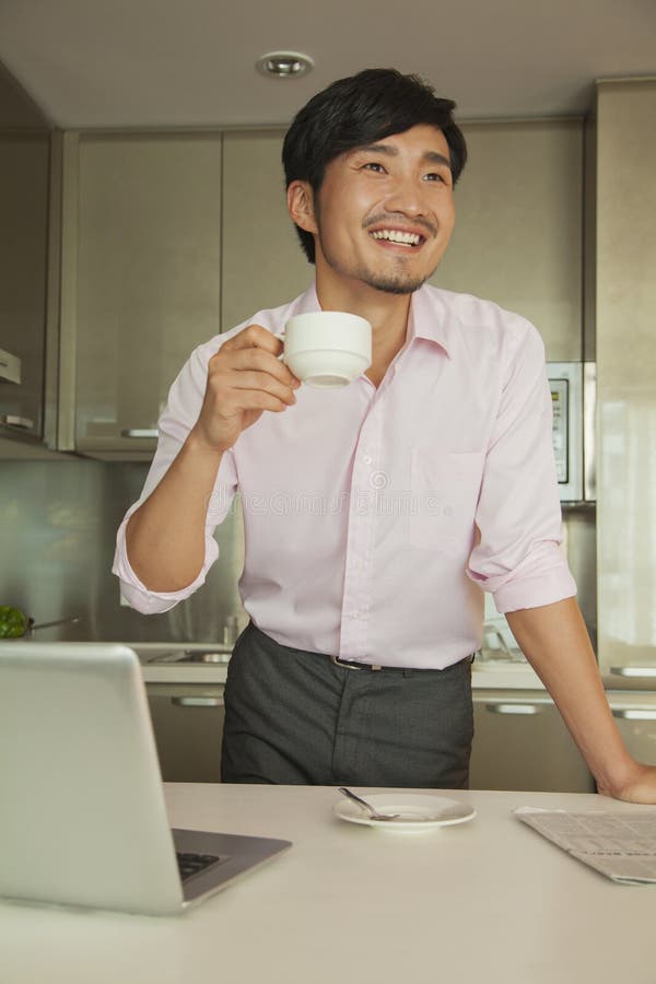Businessman in Front of His Computer Drinking Coffee at Home Stock ...