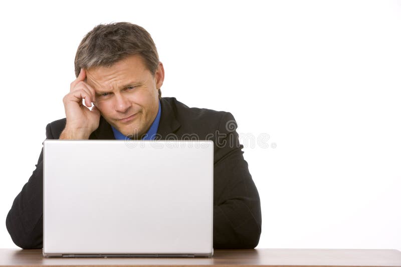 Businessman Frowning while Looking at Laptop Stock Image - Image of ...