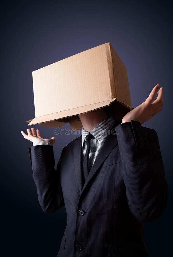Businessman Gesturing with a Cardboard Box on His Head Stock Photo ...