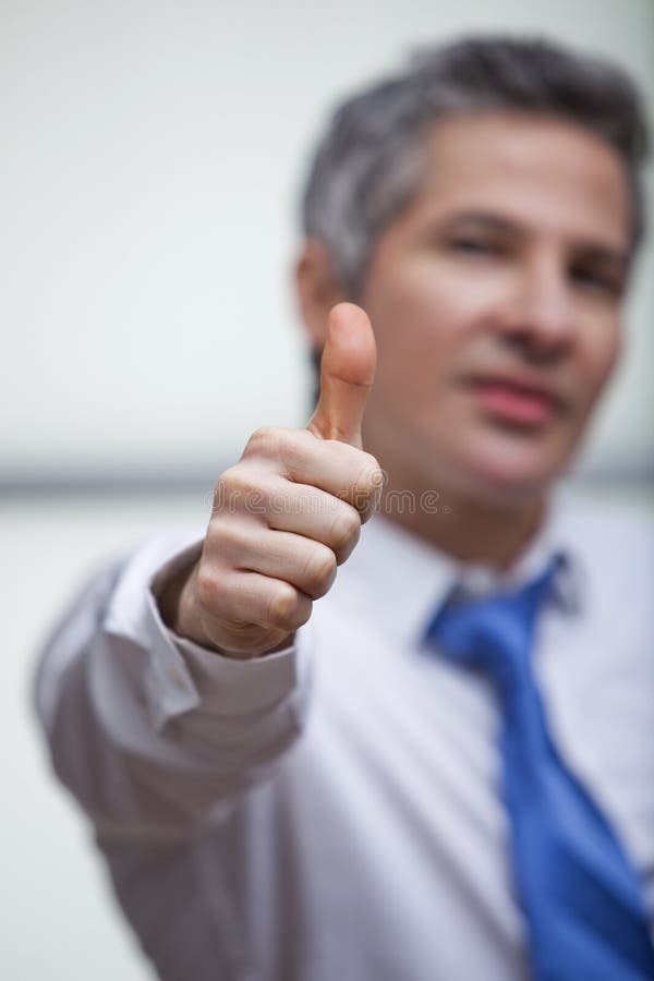 Businessman with thumb up stock photo. Image of male - 29711280