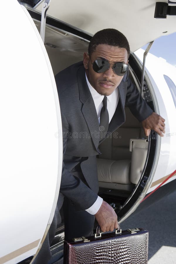 Businessman Getting Down from Airplane Stock Photo - Image of holding ...