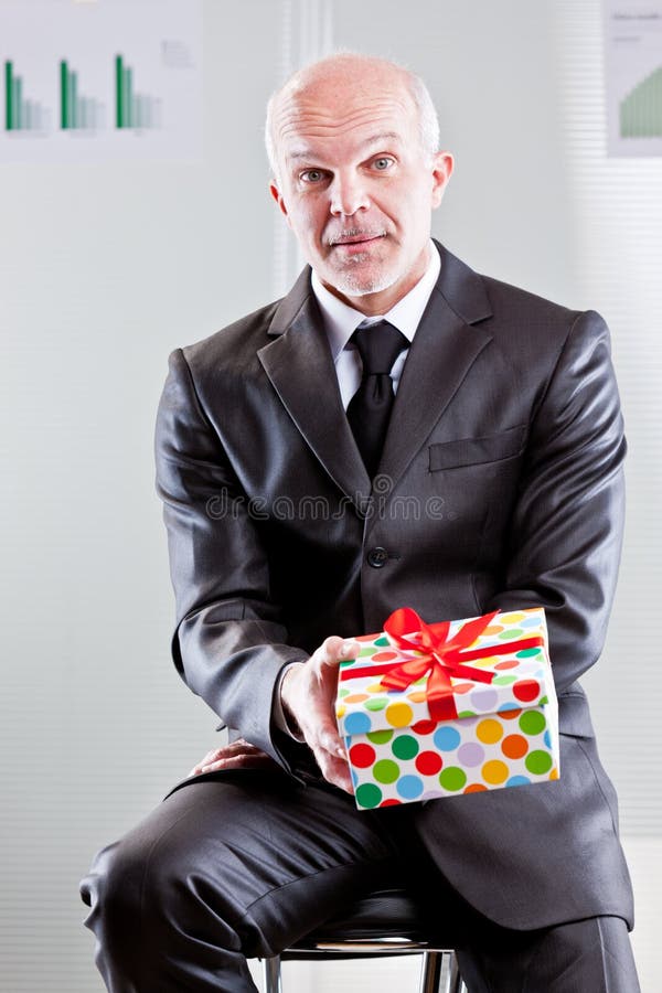 Businessman with a Gift in His Hands Stock Photo - Image of hiring ...