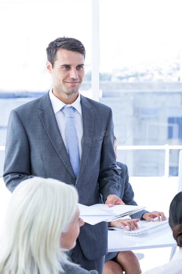 Businessman give a paper stock photo. Image of colleagues - 55560184
