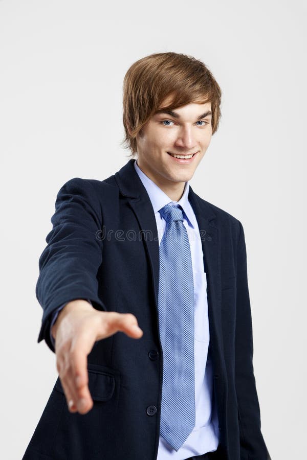 Businessman Giving a Handshake Stock Photo - Image of business, person ...
