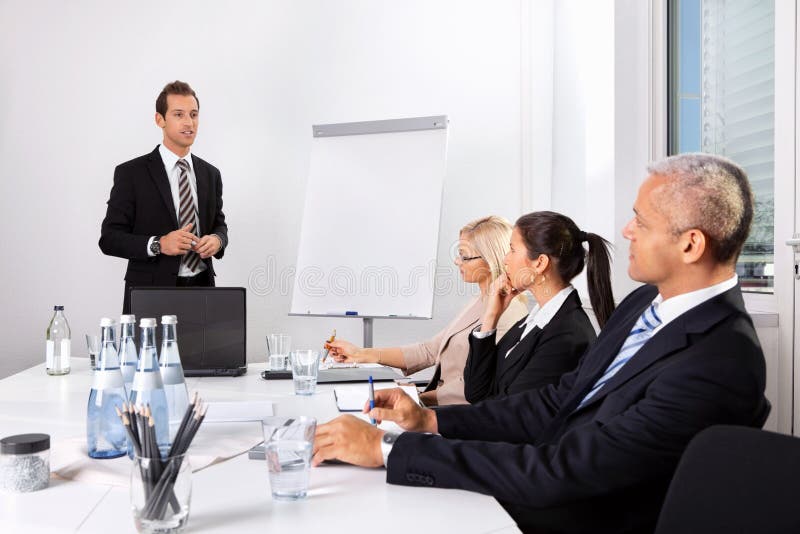 Businessman Giving a Presentation Stock Photo - Image of looking ...