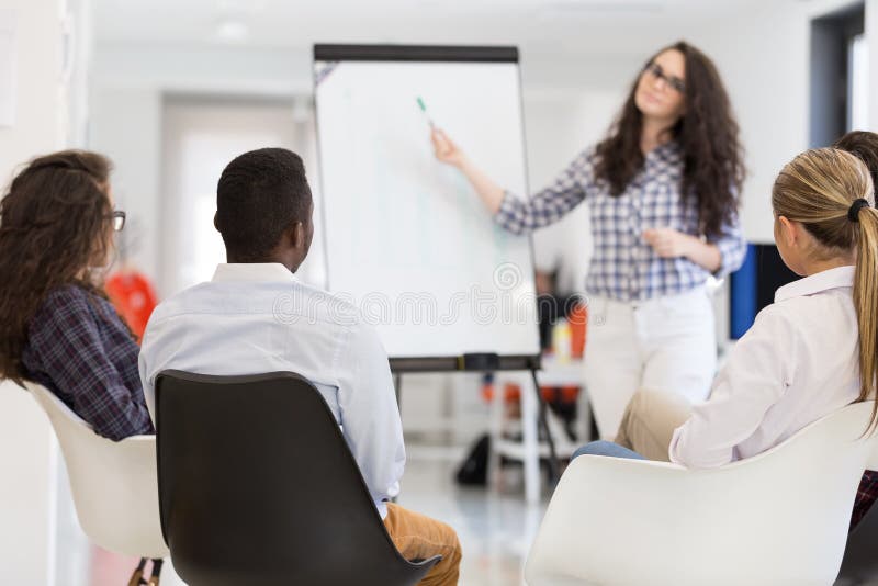 Businessman Giving a Presentation To His Colleagues at Work Stock Photo ...