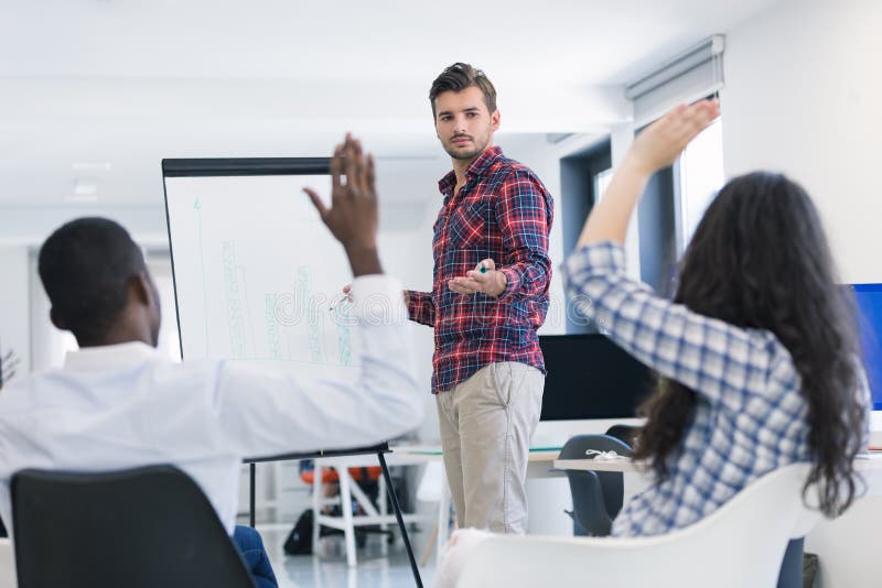 Businessman Giving a Presentation To His Colleagues at Work Stock Image ...