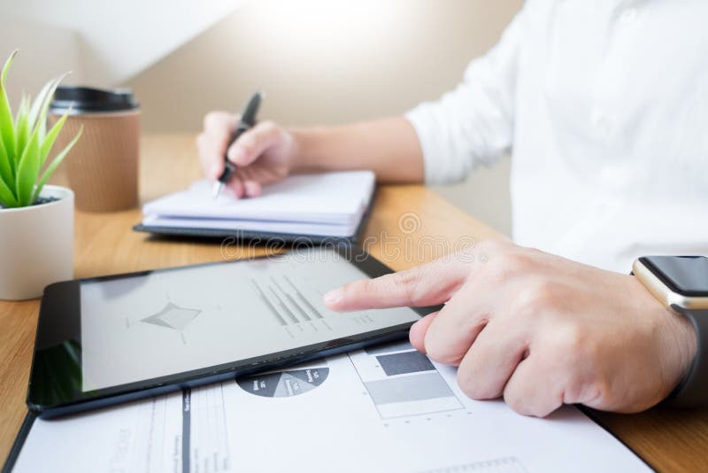 Businessman Going through Some Paperwork and Signing a Document Stock ...