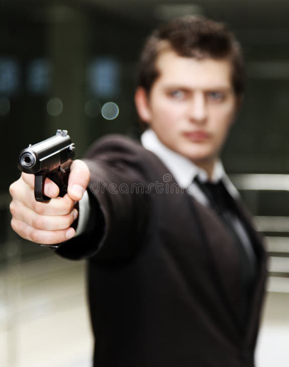 Businessman with gun stock photo. Image of attack, gunner - 18989144