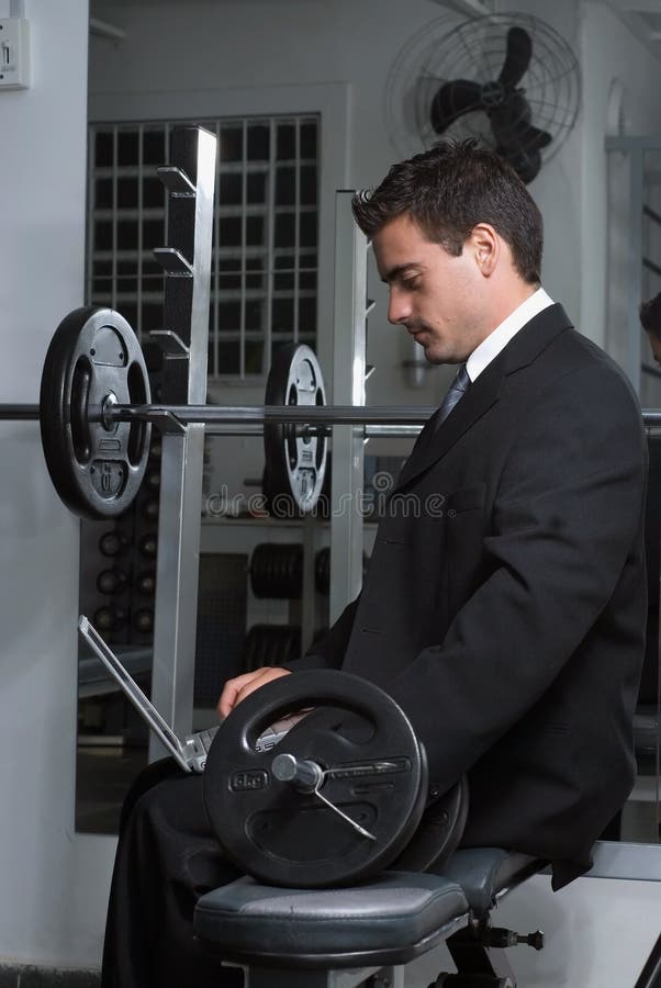 Businessman at the Gym with Laptop - Vertical Stock Photo - Image of ...
