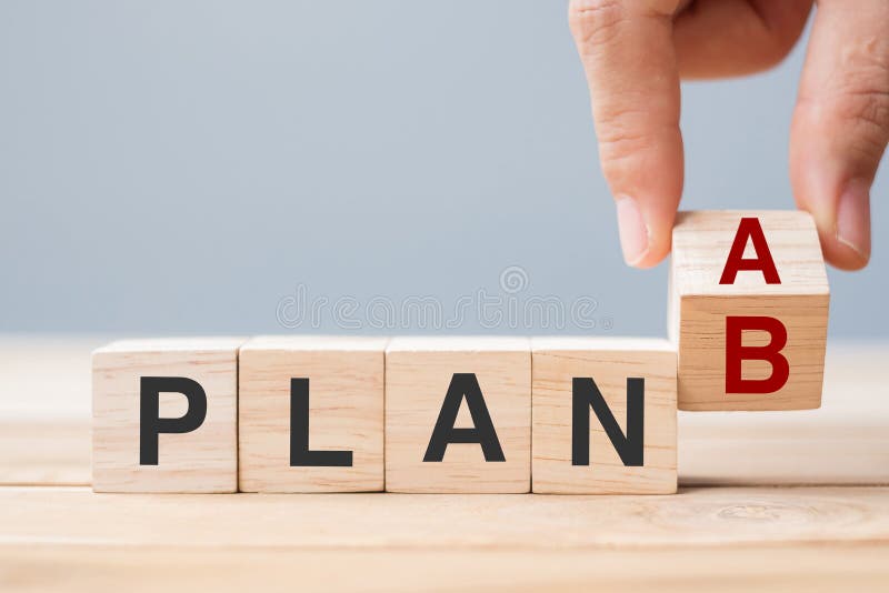 Businessman Hand Flipping Wooden Cube Blocks with PLAN a Change To PLAN ... Businessman Hand Flipping Wooden Cube Blocks with PLAN a Change To PLAN ...