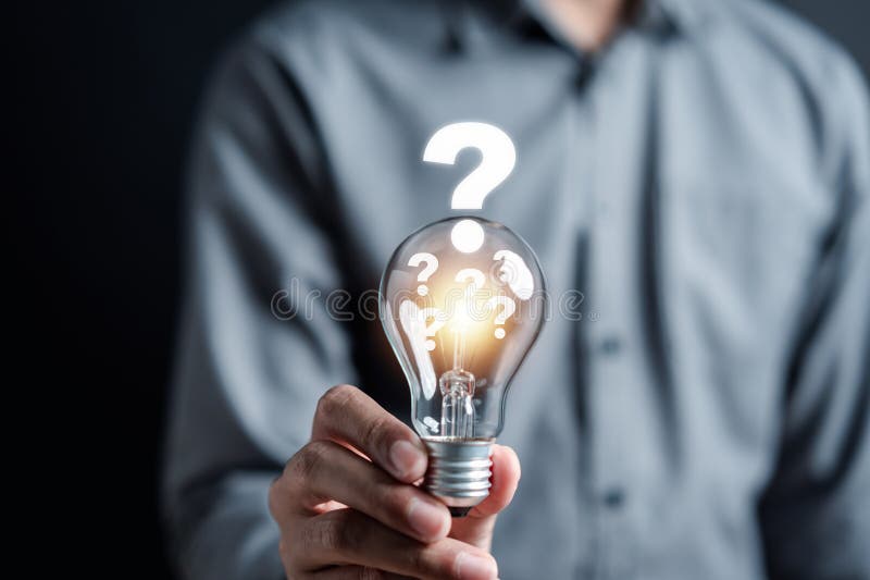 Businessman Hand Holding Light Bulb with Brain into Smart, Creative ...