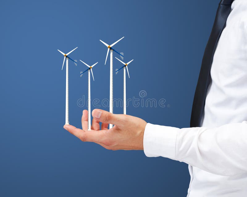 Businessman Hand Holding Wind Power Stock Photo - Image of energy ...