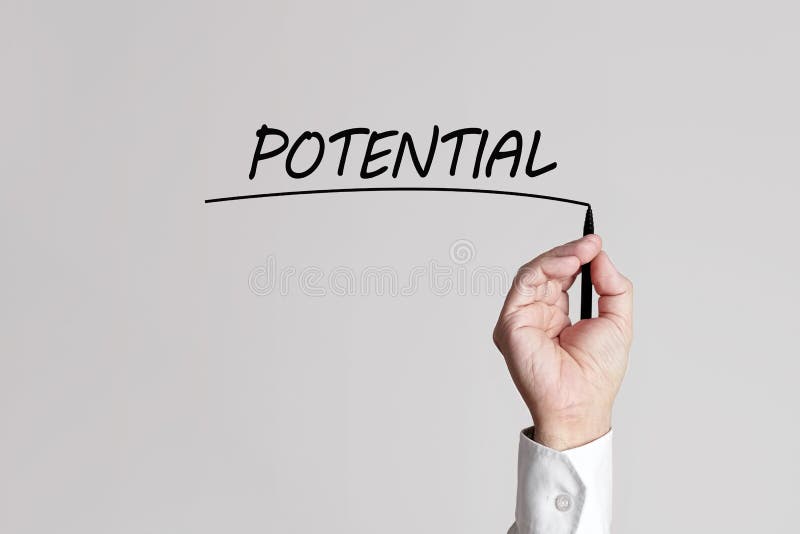 Businessman Hand with Pen Underlines the Word Potential on a Gray ...
