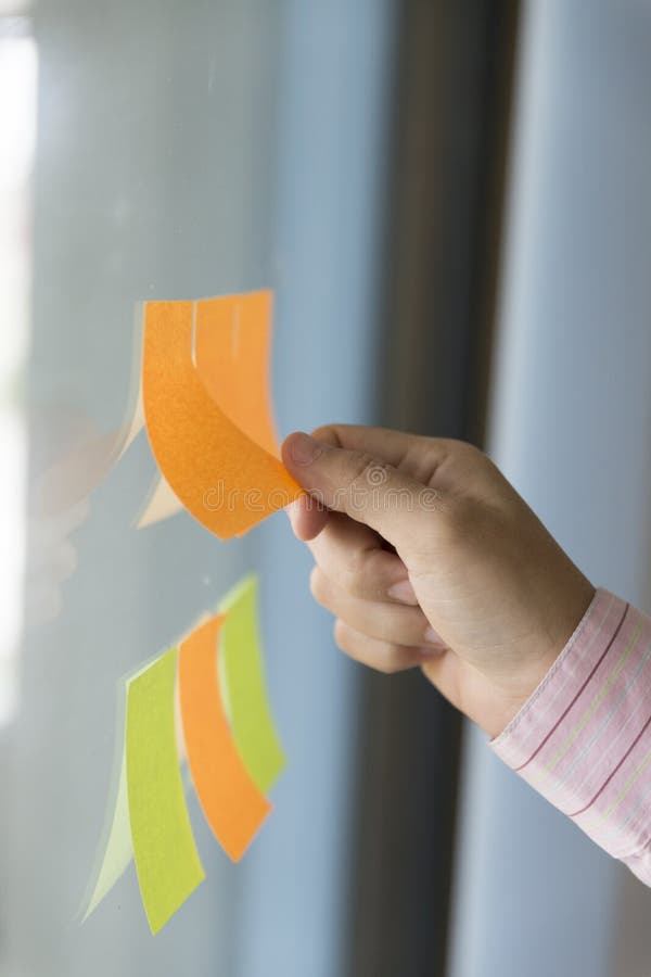 Businessman Hand Pulling Sticky Note on Glass Window Stock Photo ...