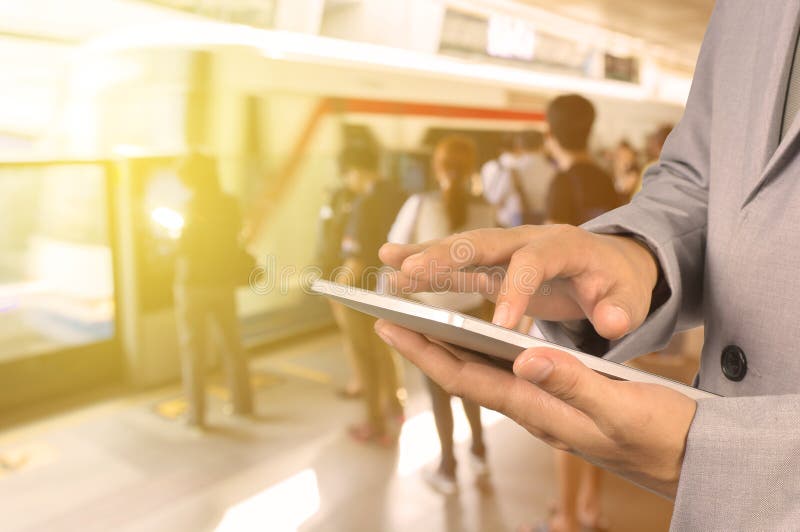 Businessman Hand Use Wireless Tablet PC Device in Railway Station Stock ...