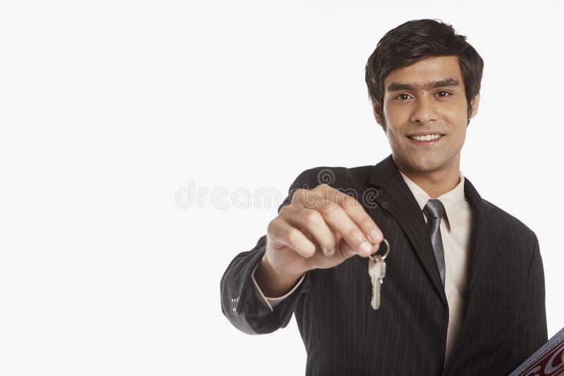 Businessman Handing Out a Set of Keys Stock Photo - Image of corporate ...