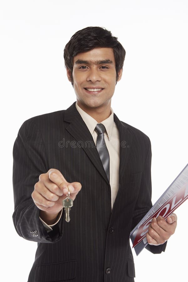 Businessman Handing Out a Set of Keys Stock Image - Image of business ...