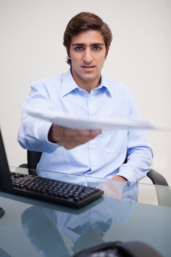 Businessman Handing Over Paperwork Stock Photo - Image of employee ...