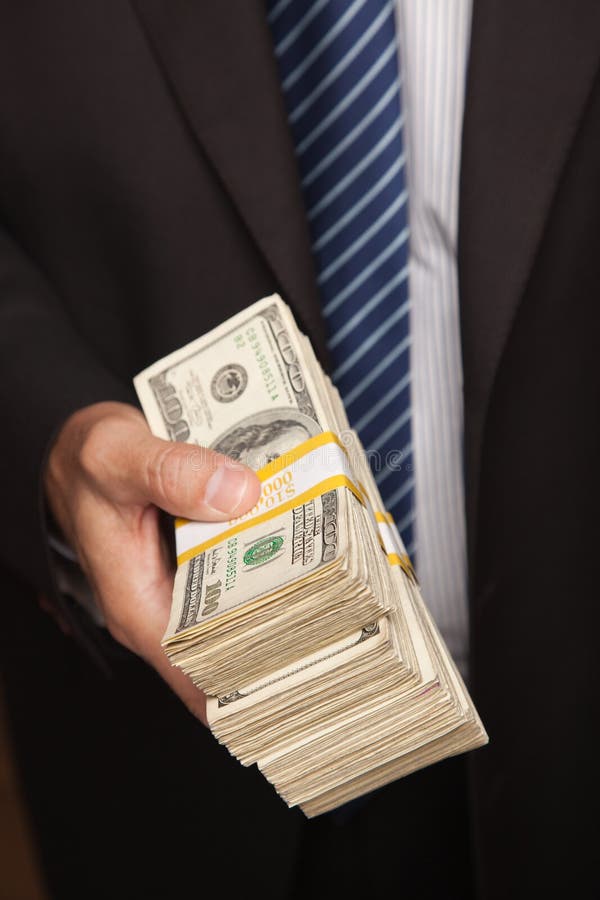Businessman Handing Over Stacks of Money Stock Photo - Image of human ...