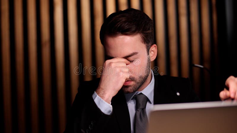 Tired Man Behind a Computer Screen from Boring Routine Work in the ...
