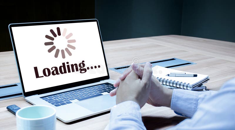 Businessman Hands Clasped Together with Icon Loading on Display Laptop ...