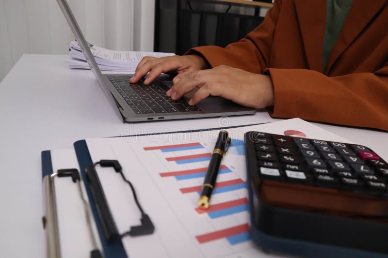 Businessman Hands Searching for Data on Notebook with Analyzing Charts ...