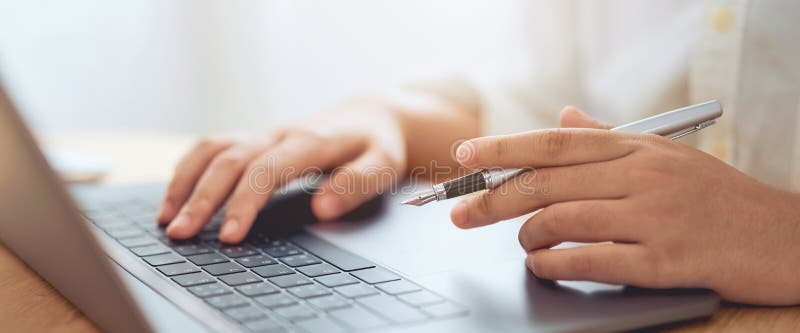 Businessman Hands Using Laptop Computer with Holding Pen and Learning ...