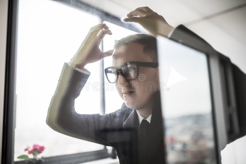 Businessman with Hands on Window Stock Photo - Image of attractive ...