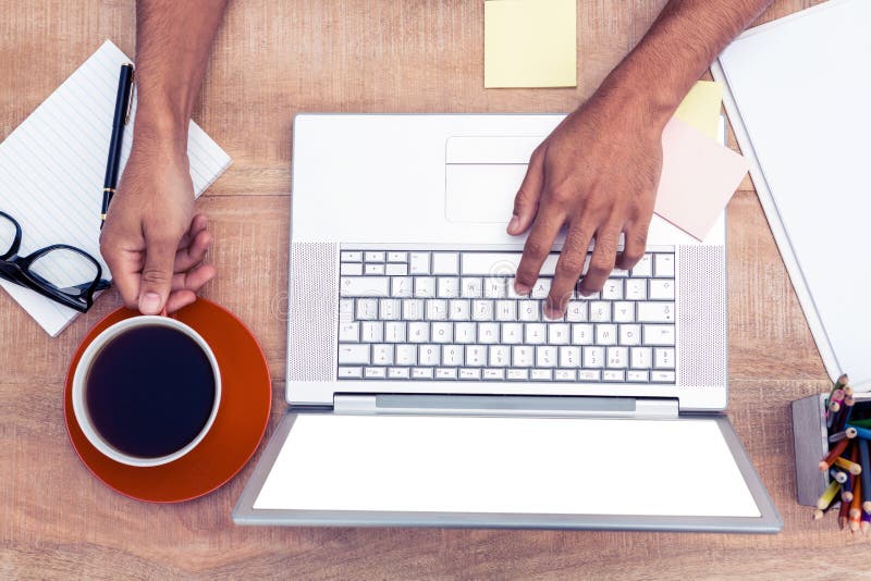 Businessman Having Coffee while Typing on Laptop Stock Photo - Image of ...