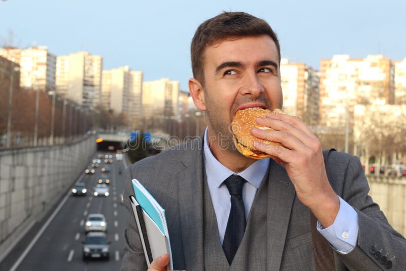 Businessman Having Fast Food in the City Stock Photo - Image of ground ...